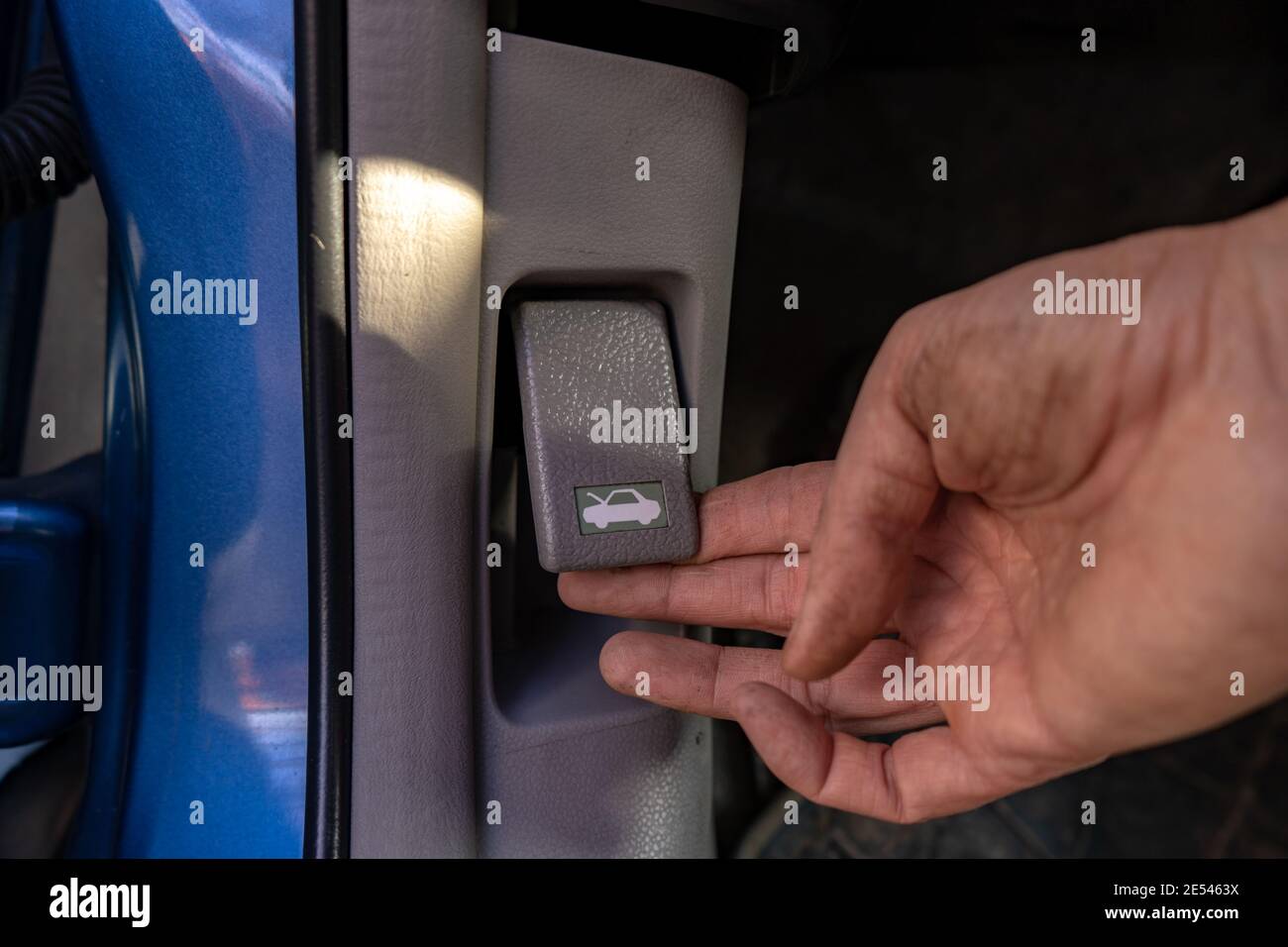 push the button under the dashboard to open the car hood Stock Photo ...