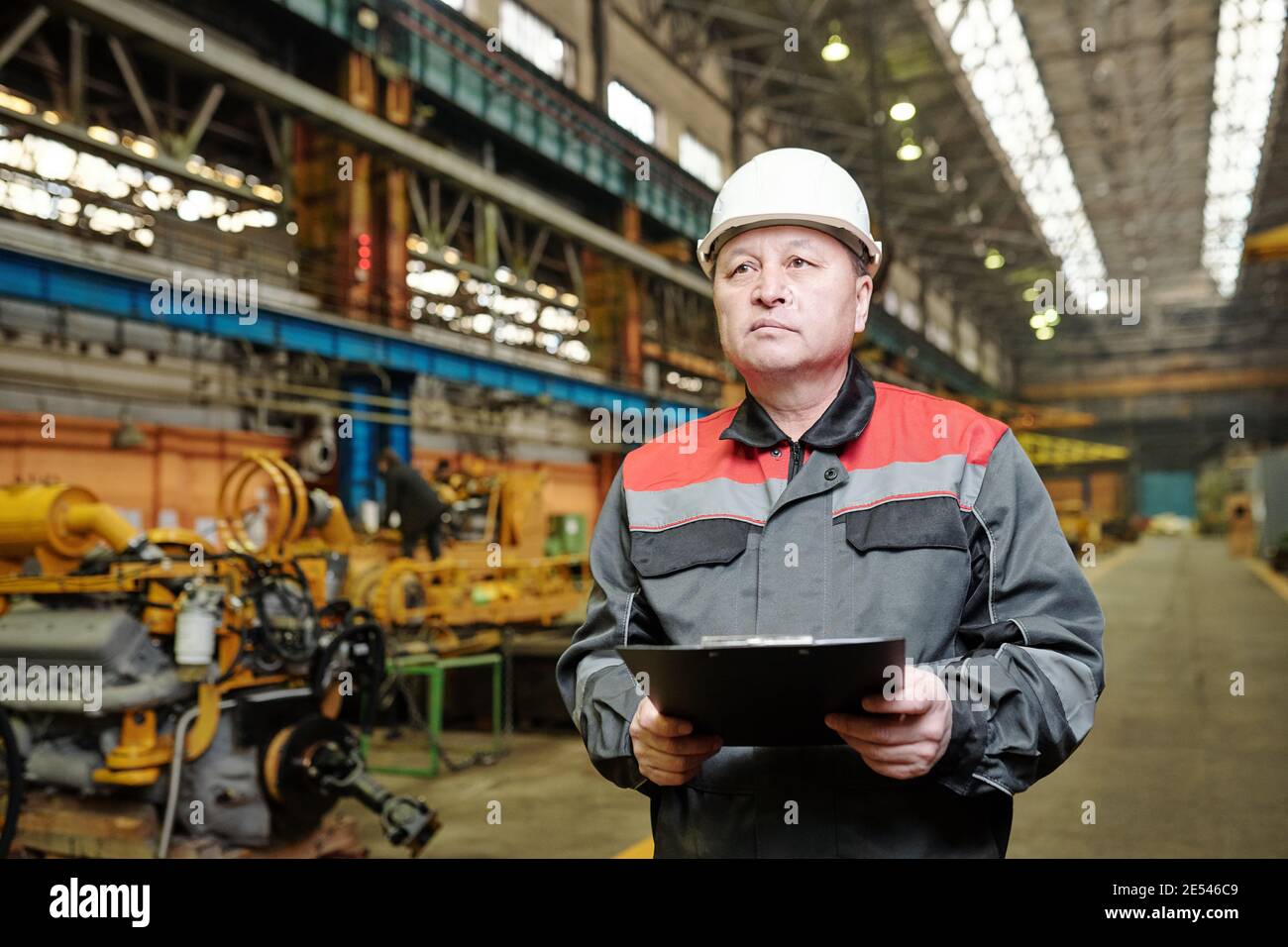 Mature manager holding documents hi-res stock photography and images ...