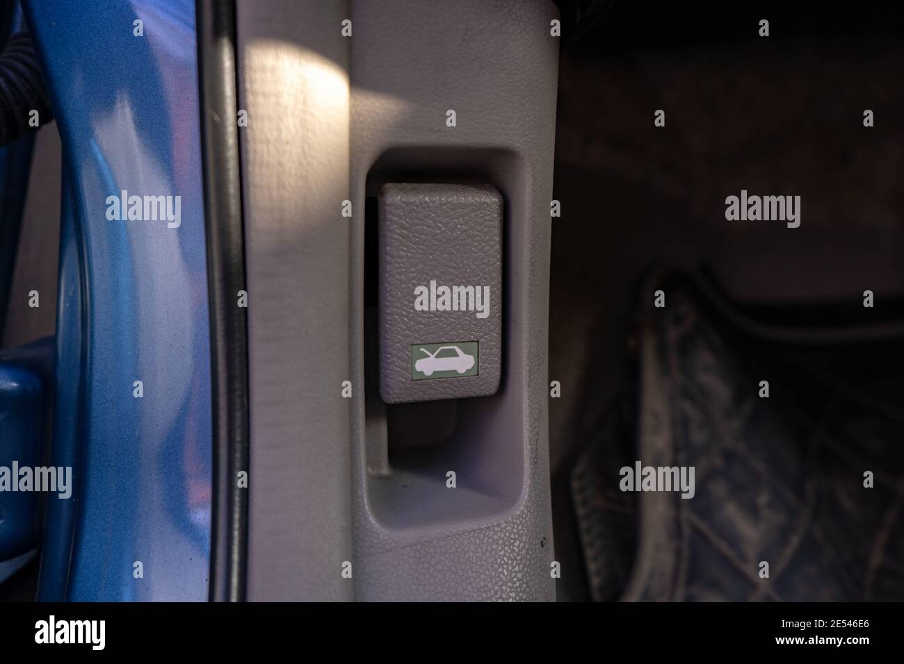 push the button under the dashboard to open the car hood Stock Photo ...