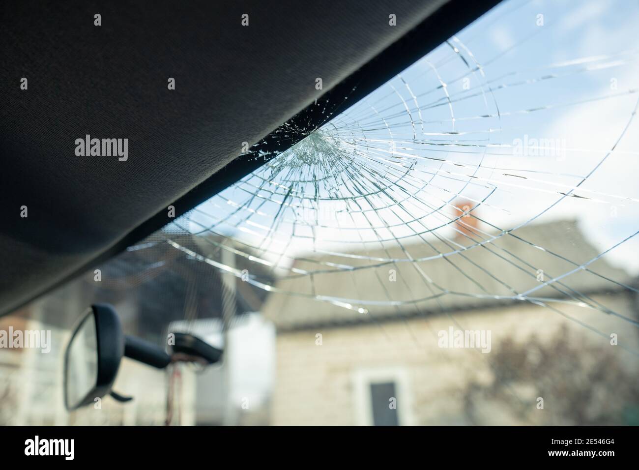 broken windshield with a lot of cracks and small glass pieces, damaged ...