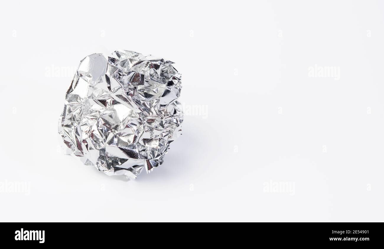 crumpled piece of gray foil on a white background, copy space Stock ...