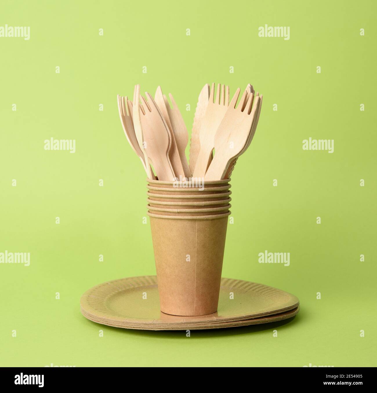 brown paper cup, plates on a green background. Plastic rejection ...
