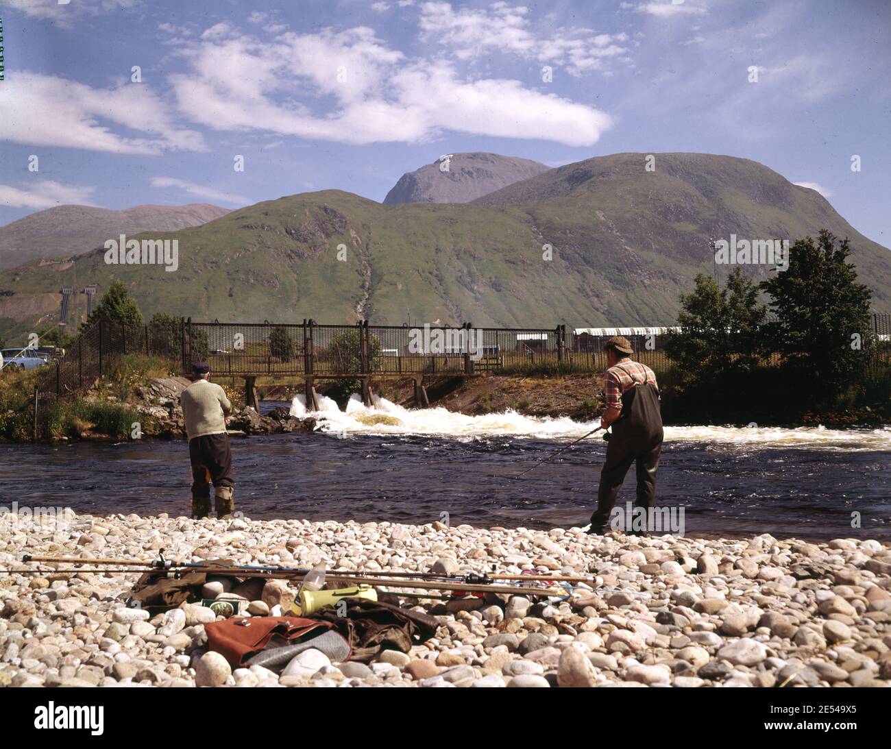 Scotland, Highlands. Salmon fishing on the River Lochy with Ben Nevis ...
