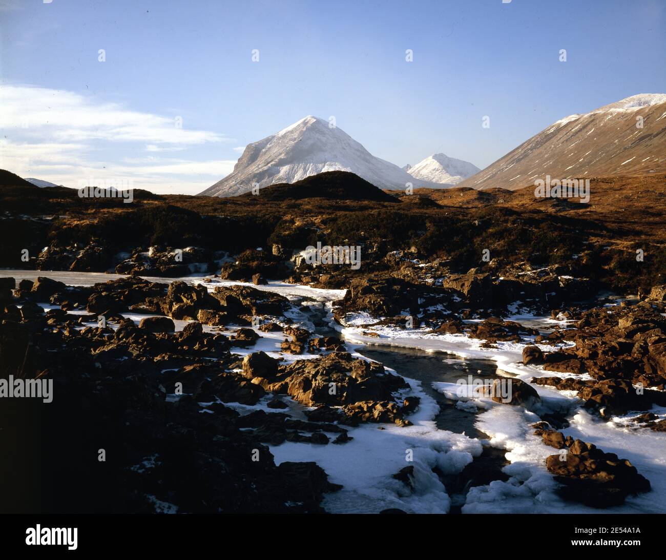 Scotland, Skye. Marsco and the frozen River Sligachan. The track leads ...
