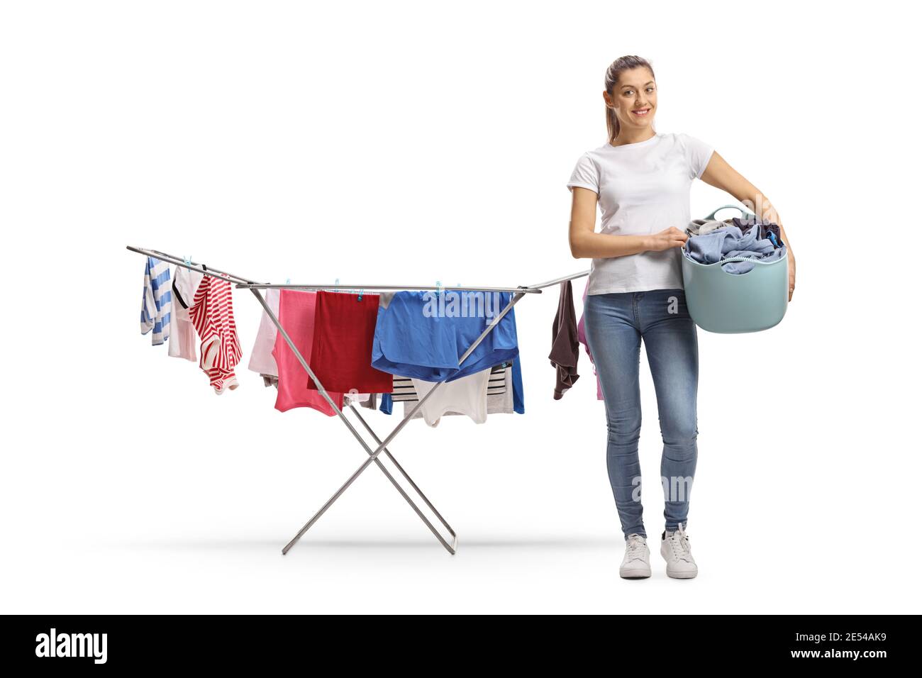 Full length portrait of a casual young female holding a laundry basket ...