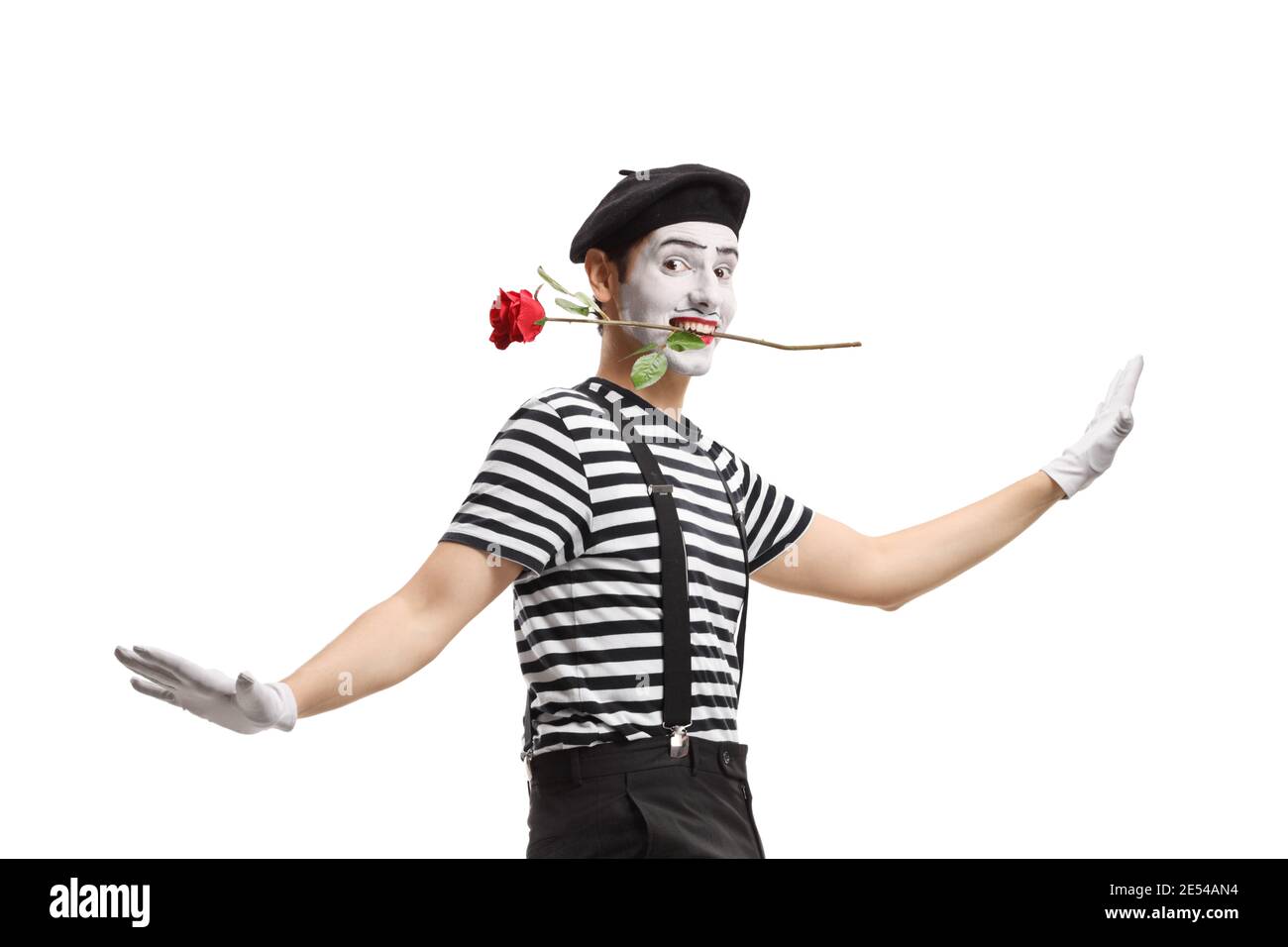 Mime holding red rose in his mouth isolated on white background Stock ...