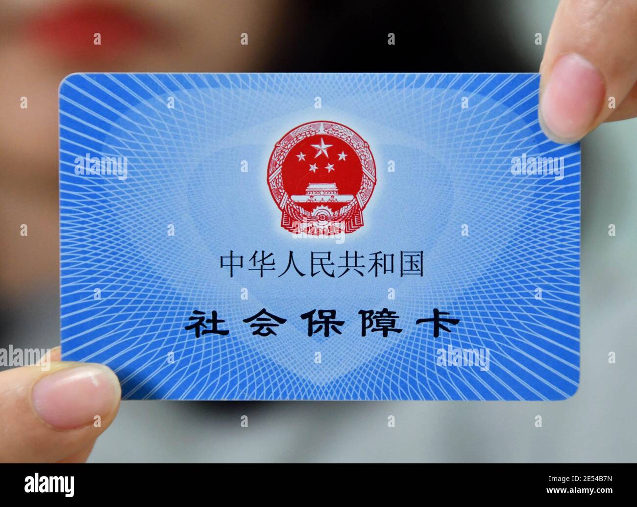 HANDAN, CHINA - JANUARY 26, 2021 - A resident shows his social security ...