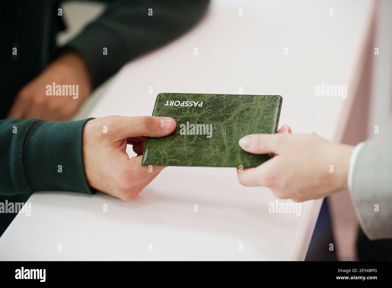 Close-up of man giving his passport for registration Stock Photo - Alamy Close-up of man giving his passport for registration Stock Photo - Alamy