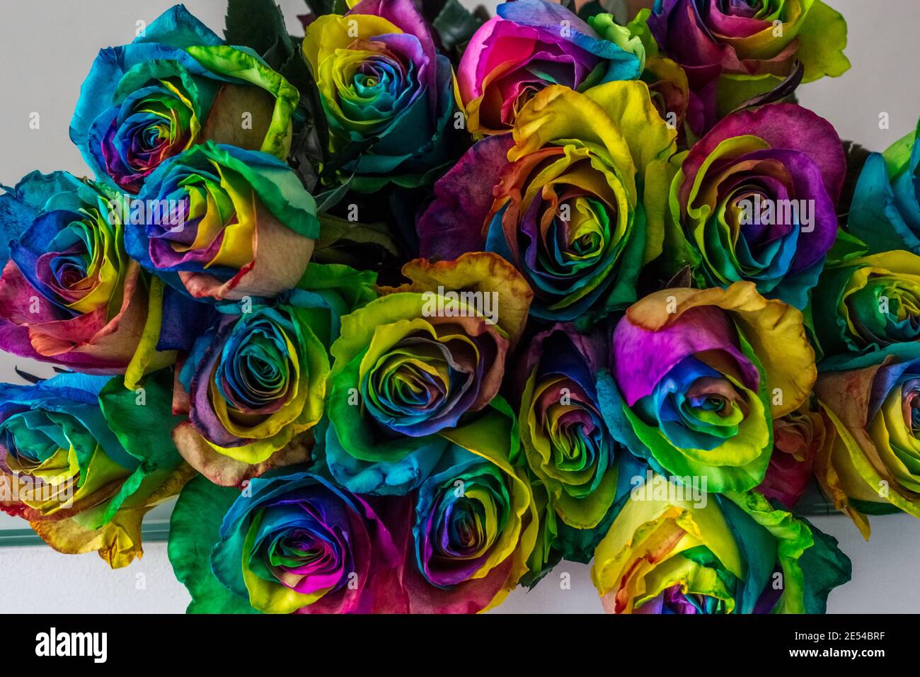 a bouquet of rainbow roses Stock Photo - Alamy