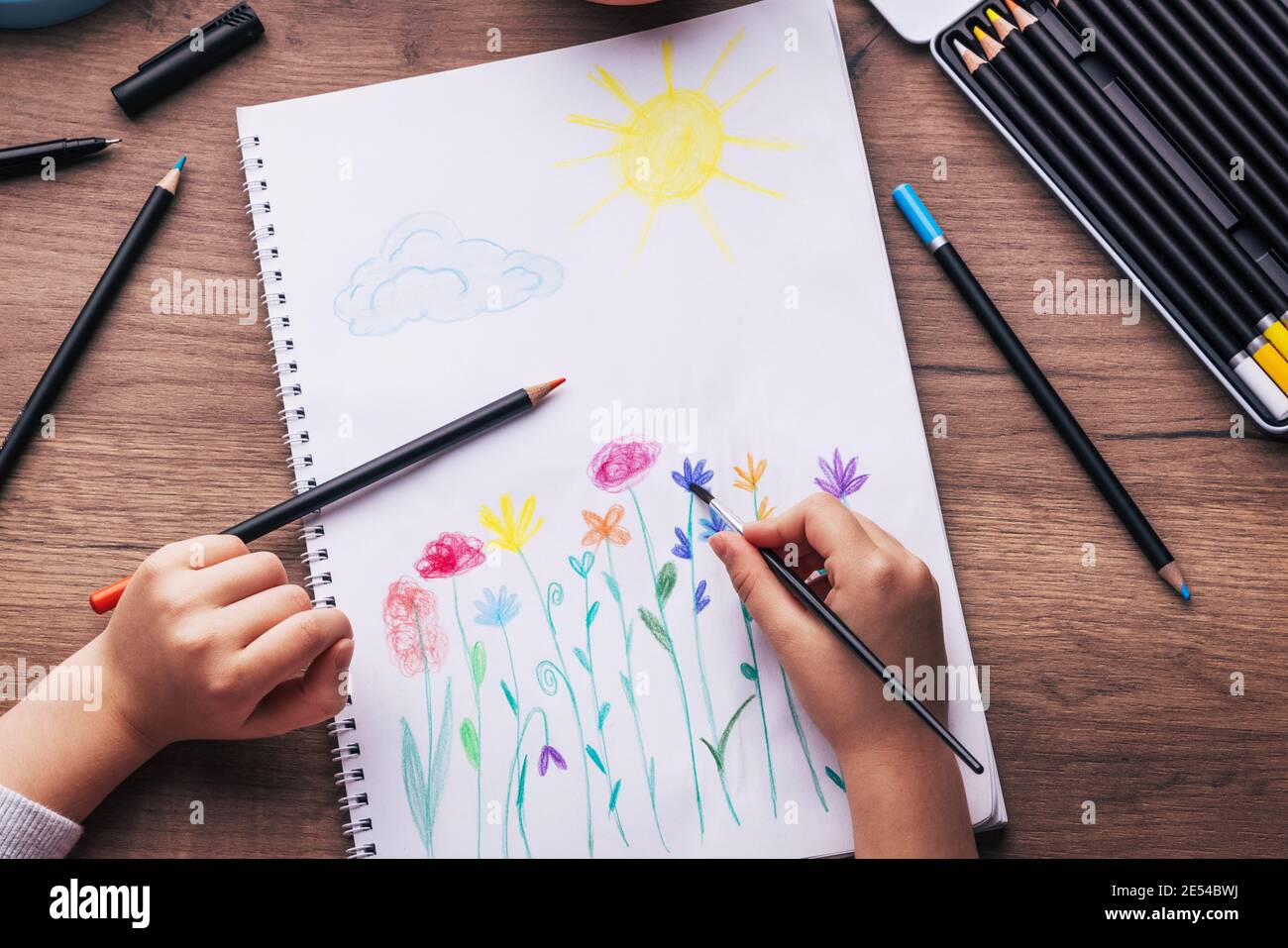 Child drawing top view. Artwork workplace with creative accessories ...