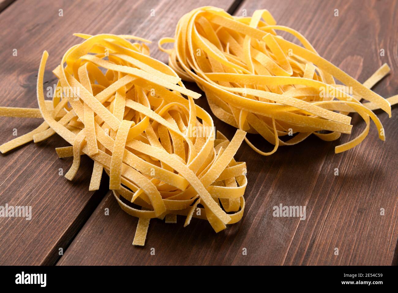 Raw Tagliatelle, traditional italian egg pasta Stock Photo - Alamy