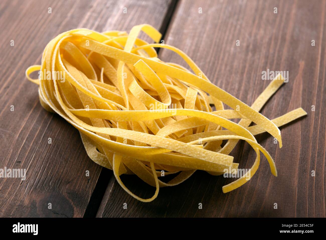 Raw Tagliatelle, traditional italian egg pasta Stock Photo - Alamy