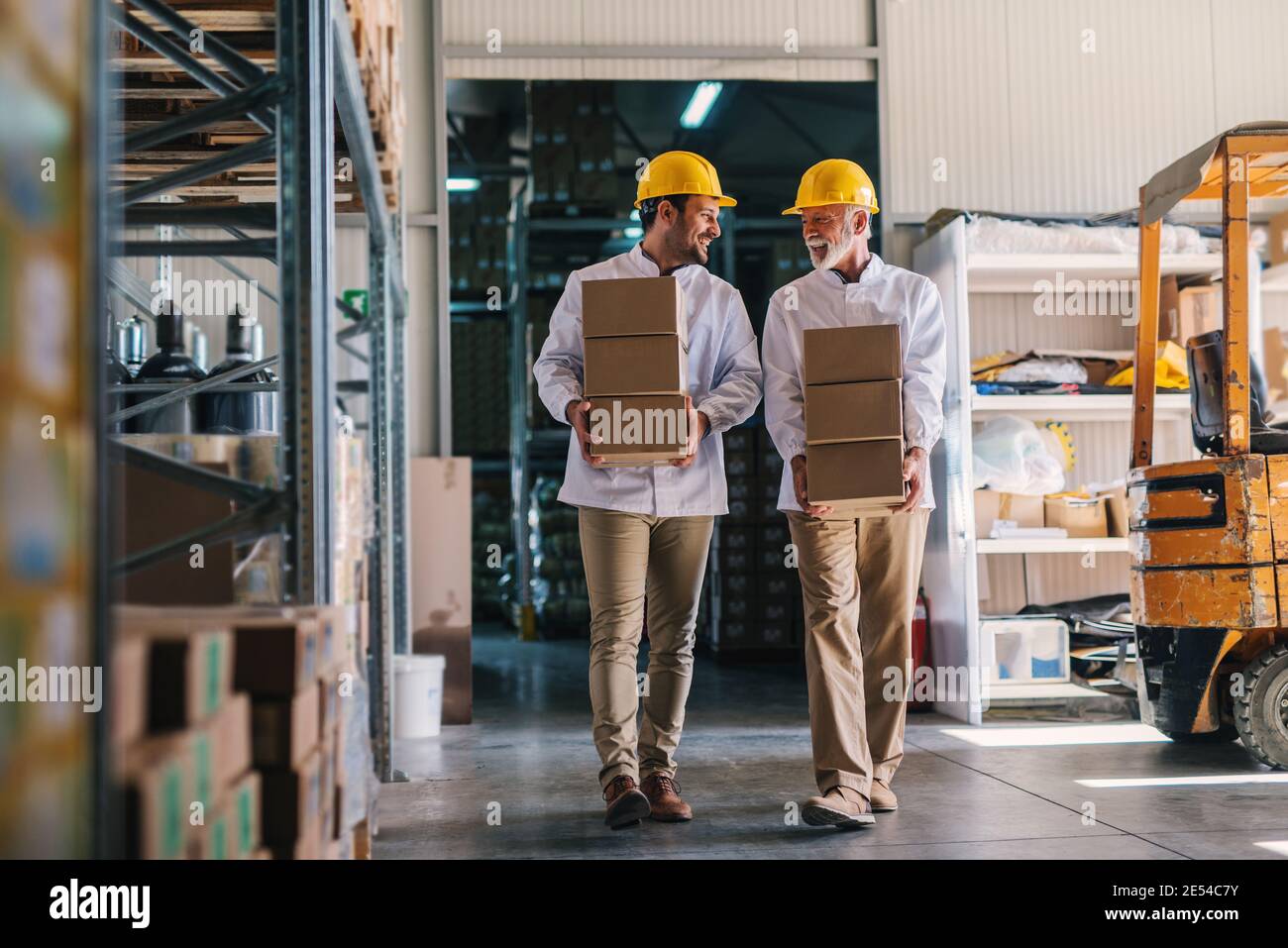 Factory employees carrying boxes hi-res stock photography and images ...