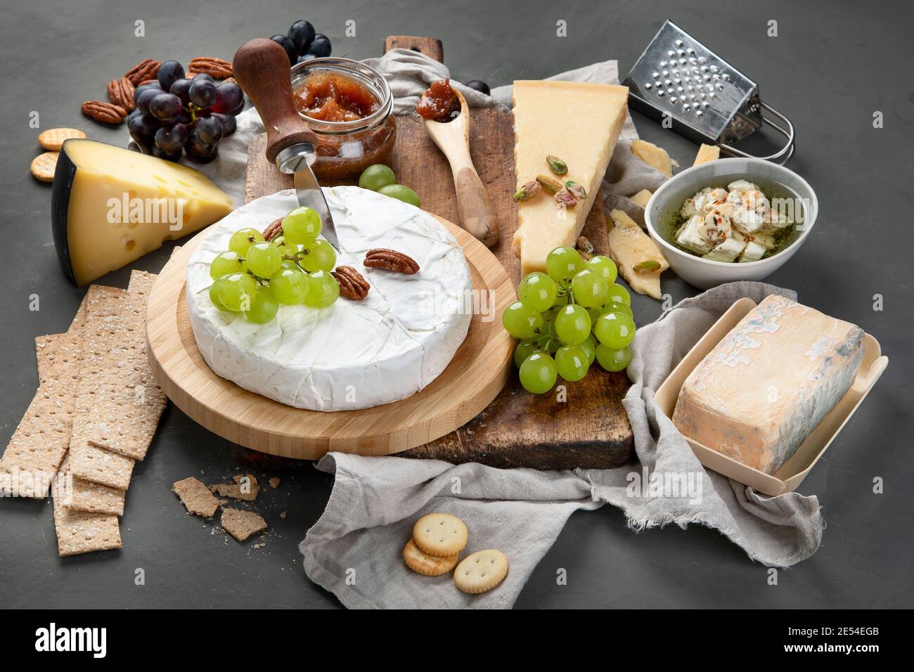 Various types of cheese on grey background Stock Photo - Alamy