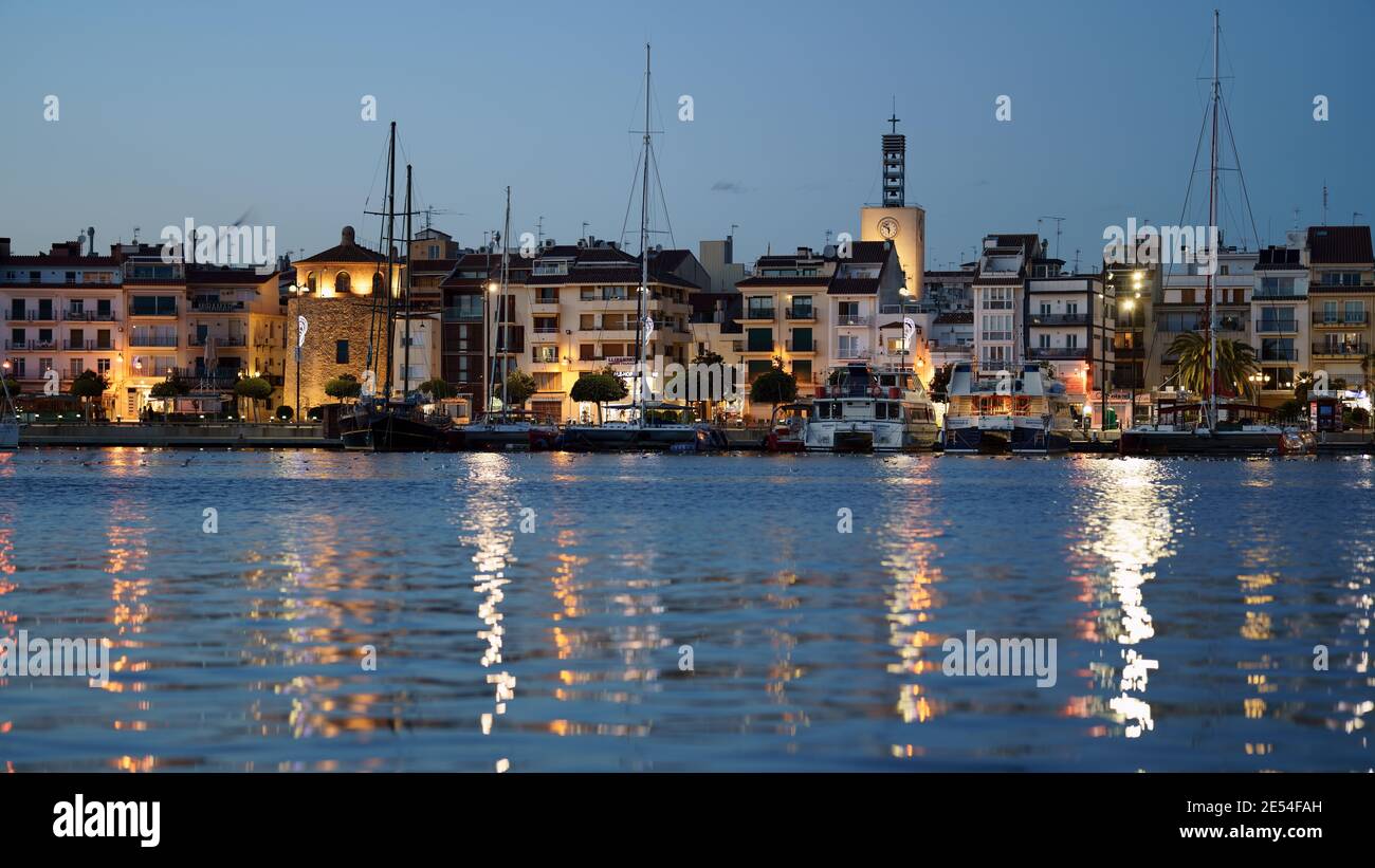 Buildings of Reus city in Spain on the shore of the sea in the evening ...