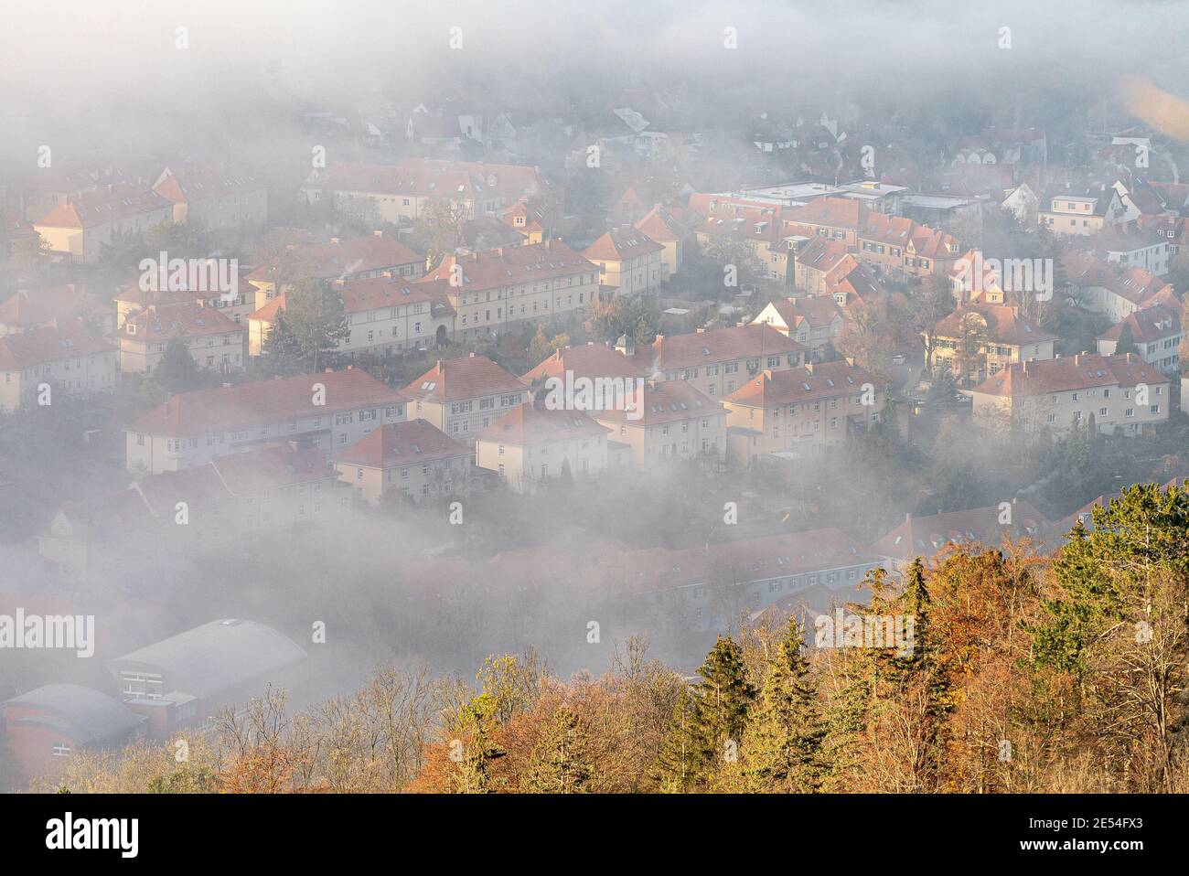 Urban Jena town cityscape with traditional buildings shrouded in dense ...