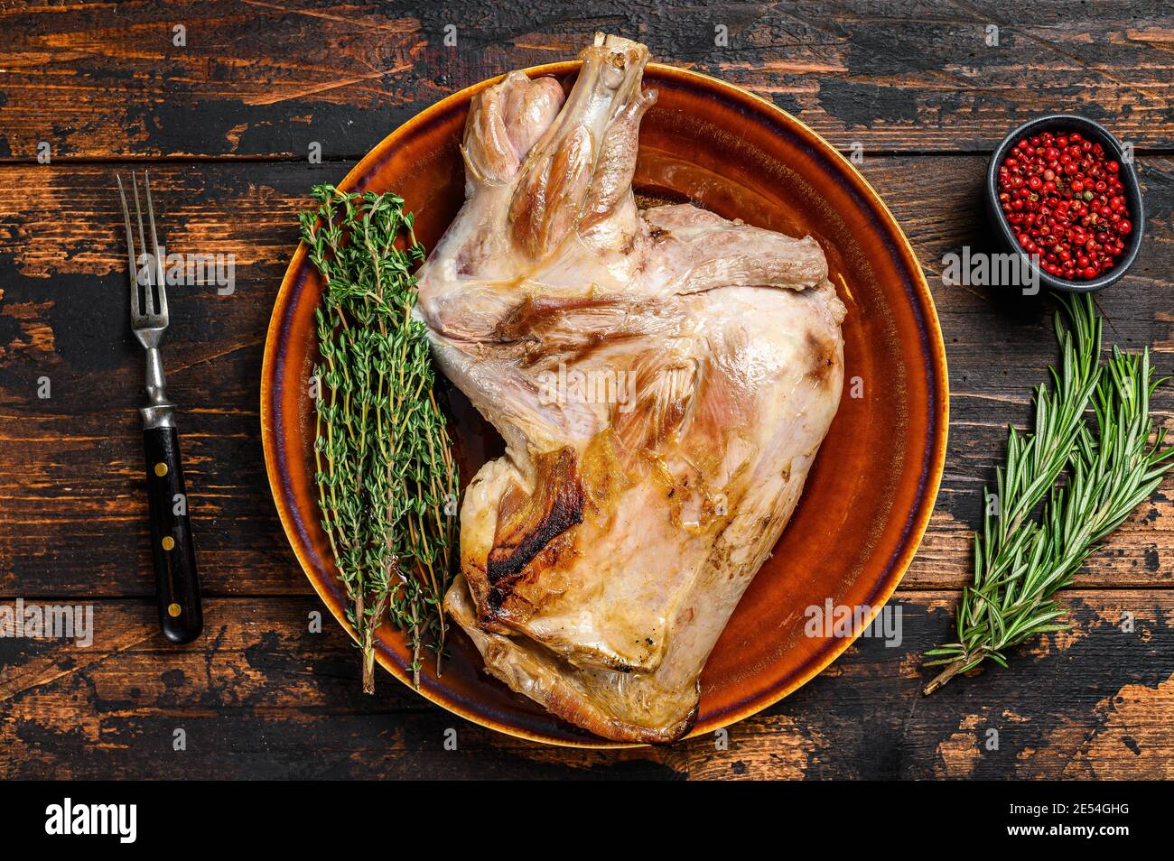 Roasted whole lamb shoulder. Dark wooden background. Top view Stock ...