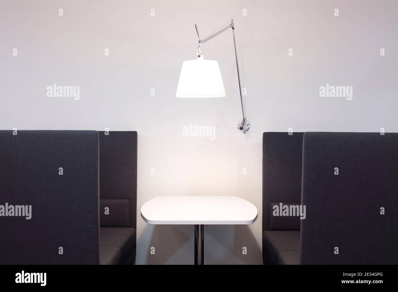 Interior Office Space with booths and wall mounted lamp, UK Stock Photo ...