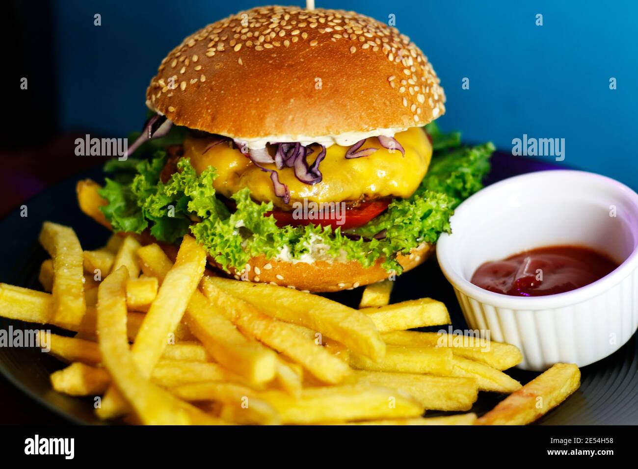 burger and fries on the plate Stock Photo - Alamy