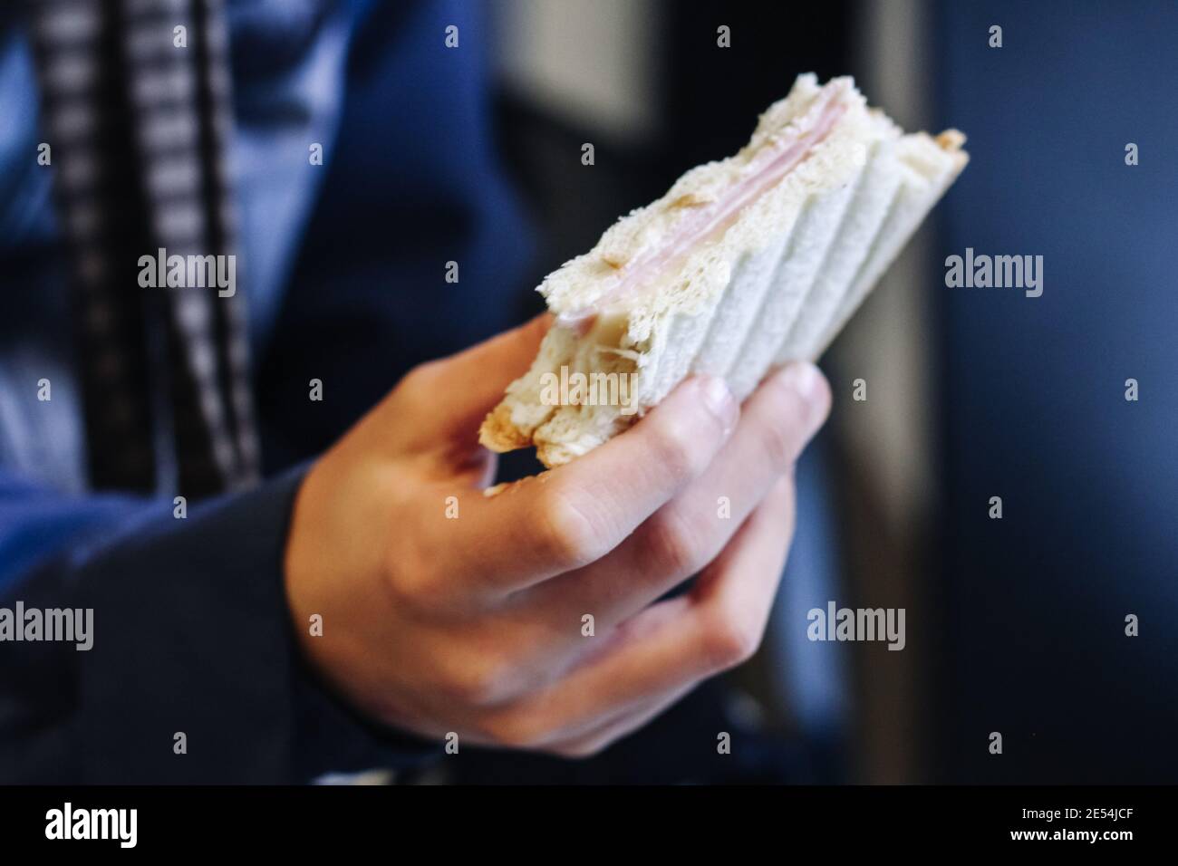 Bitten Sandwich with Ham in the Boy's Hand Stock Photo - Alamy