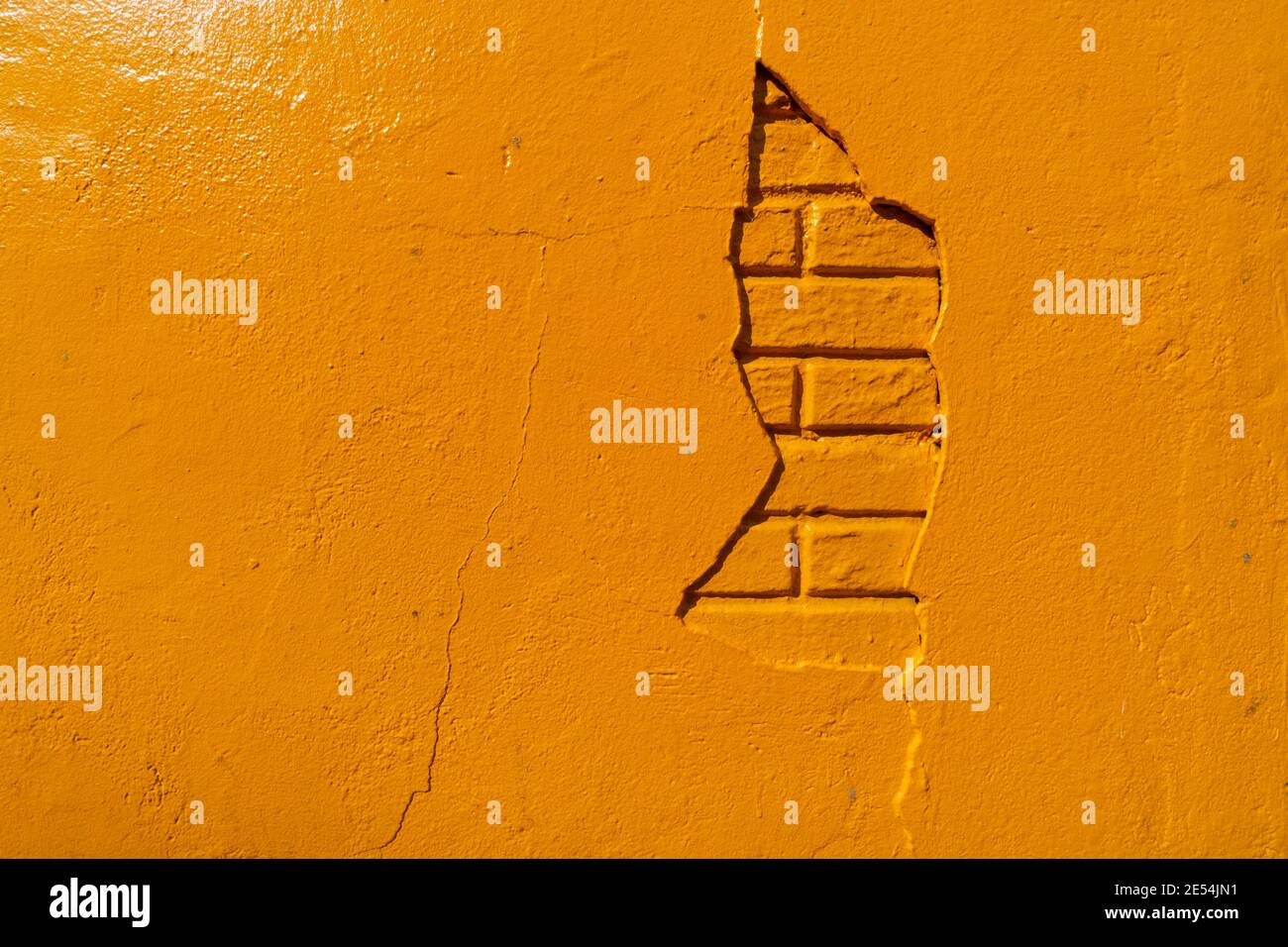 Building wall has painted in orange color at East Village NYC Stock ...