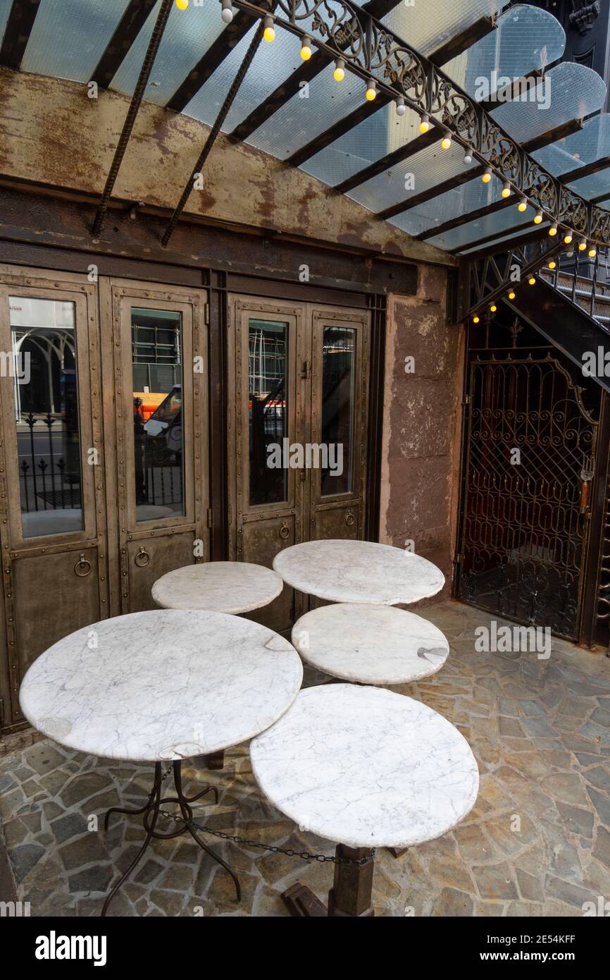 Locked tables placed in front of restaurant for prevention stolen NYC ...
