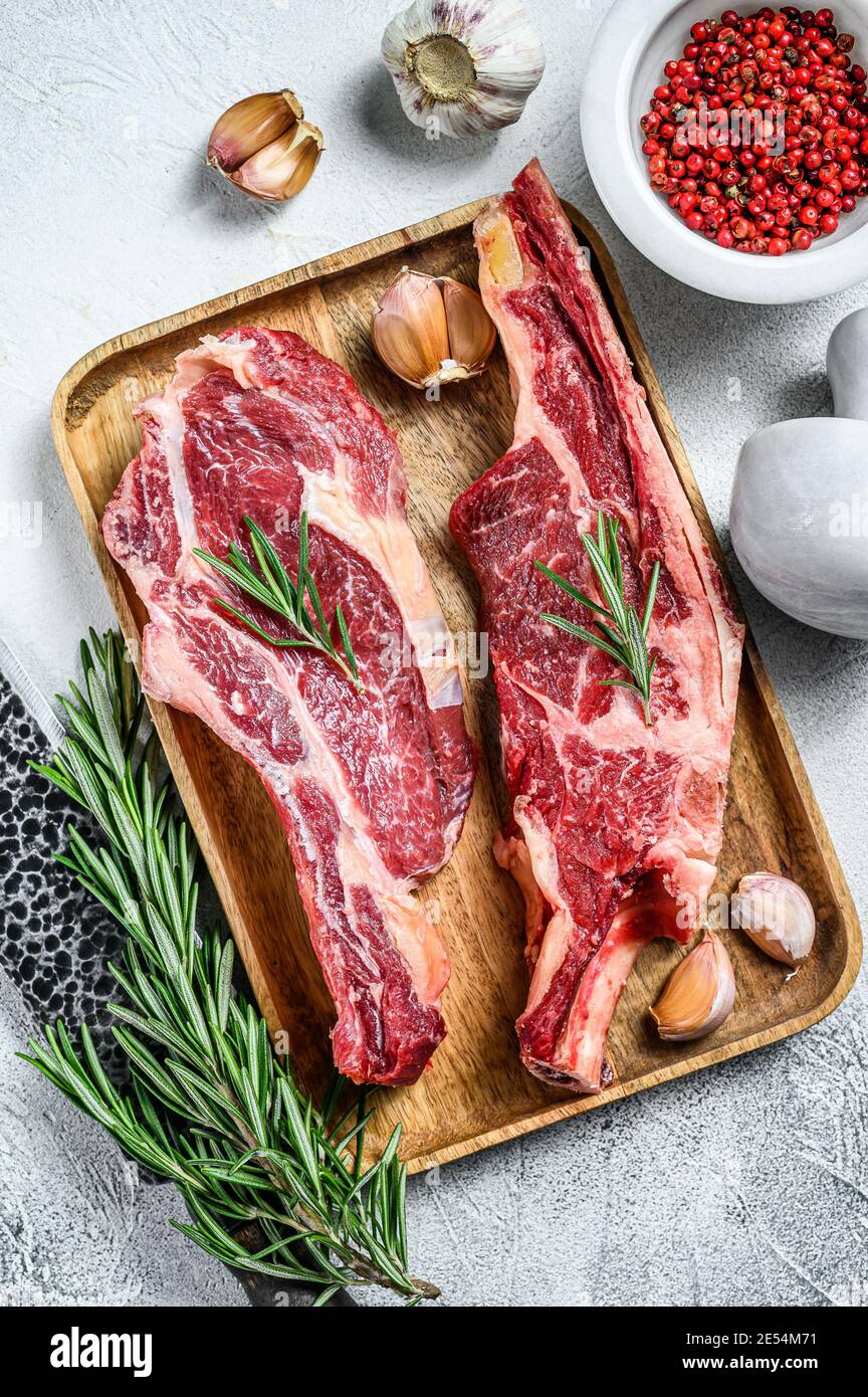 Raw cuts of beef marble meat on the bone. White background. Top view ...