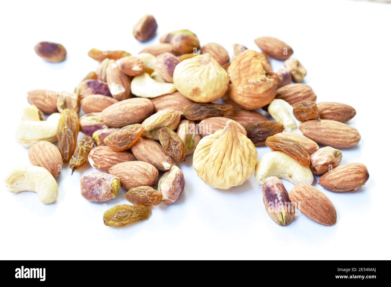 mixed nuts and dry raisin with fig on white background Stock Photo - Alamy