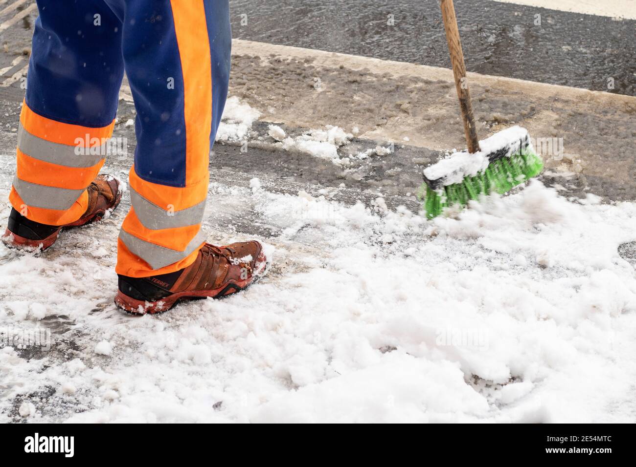 Sweeping Snow With A Broom High Resolution Stock Photography and Images ...