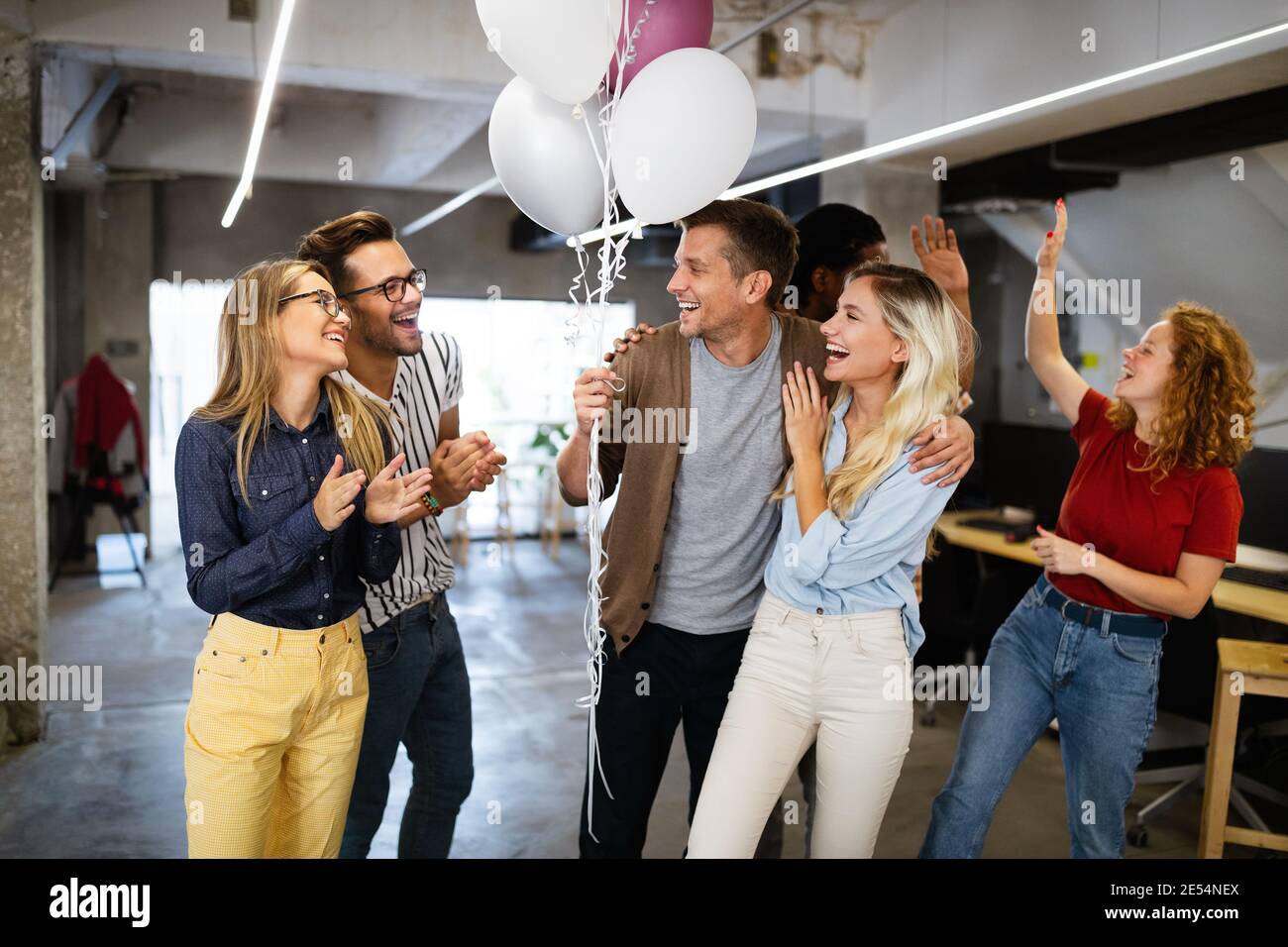 Portrait young designer celebrating success hi-res stock photography ...