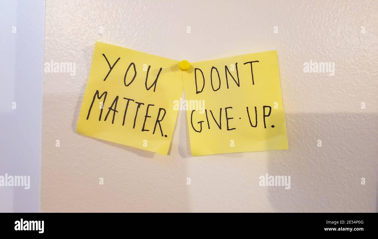 You matter, don't give up encouragement phrase written on two yellow ...