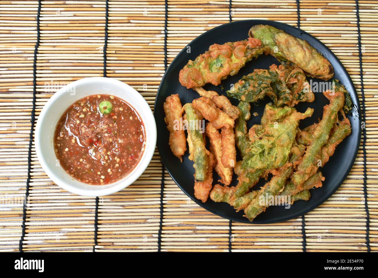 batter fried vegetable coating flour on plate dipping Thai spicy shrimp ...