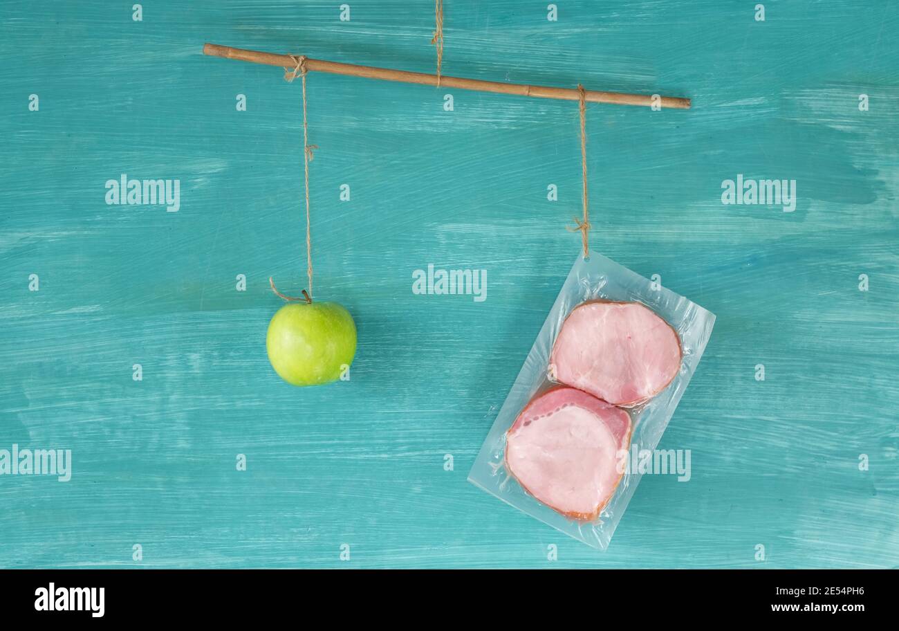 Healthy eating and low-carb diet concept, scale with apple and poor ...