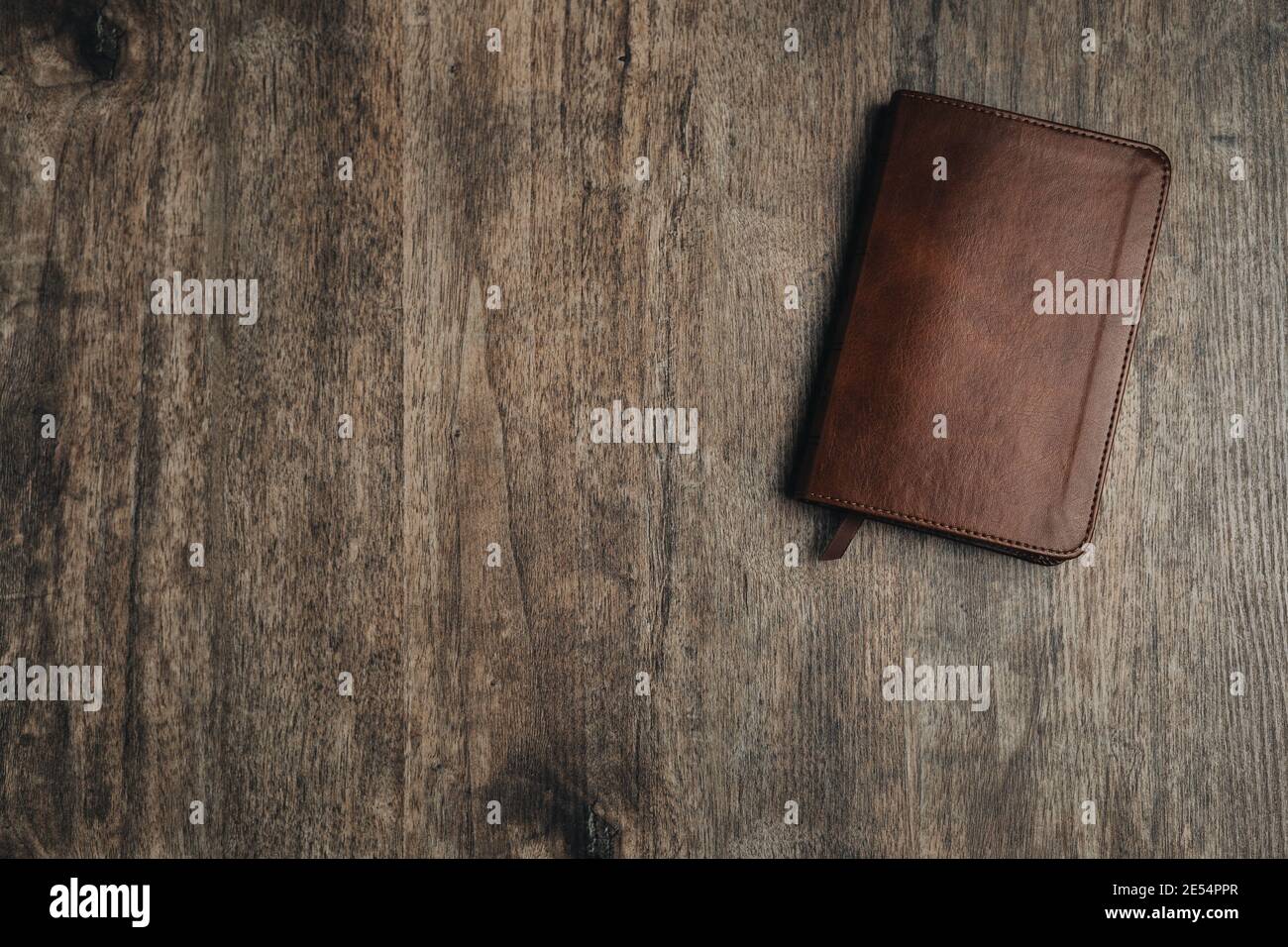 small bible on a wooden texture Stock Photo - Alamy