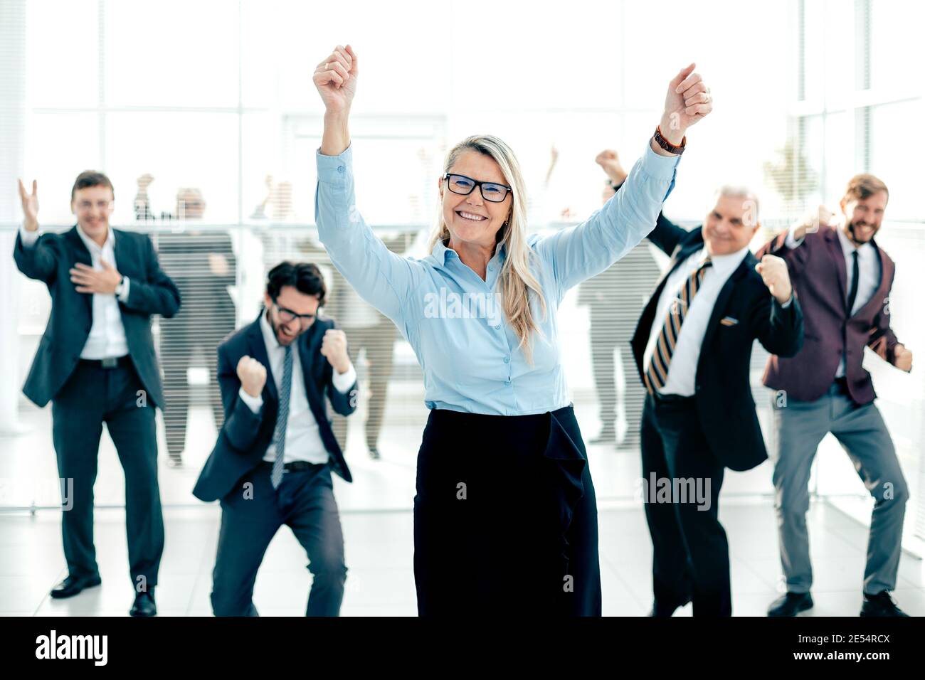 Happy employees positive manager celebrating hi-res stock photography ...