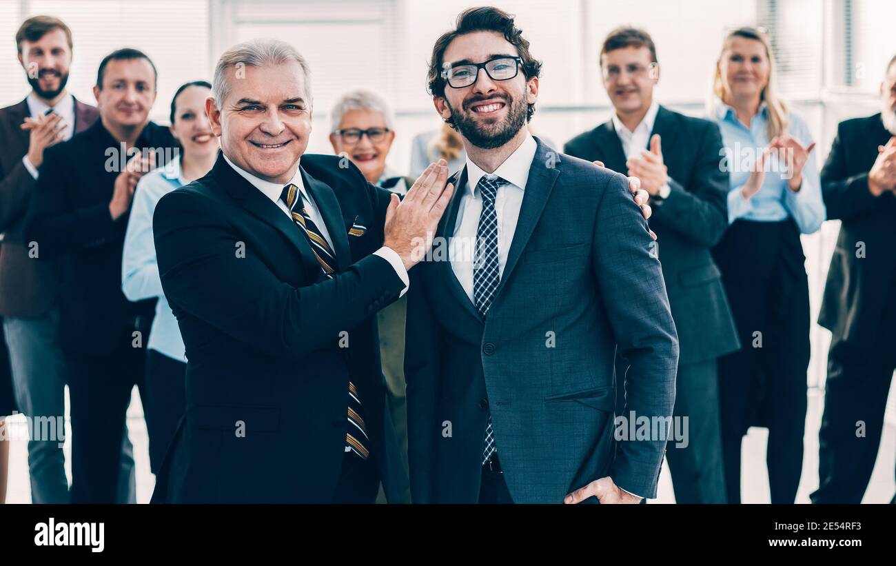 project Manager congratulating the best employee on the victory Stock ...