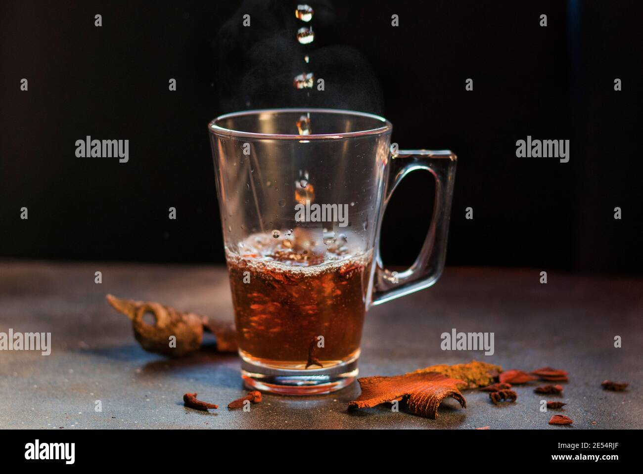 Rome with tea, Grog on the black background Stock Photo - Alamy