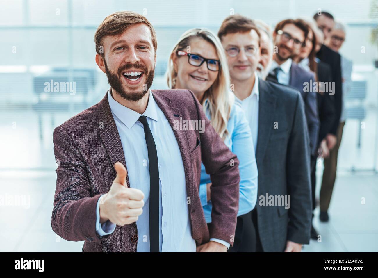 smiling successful entrepreneur giving a thumbs up Stock Photo - Alamy