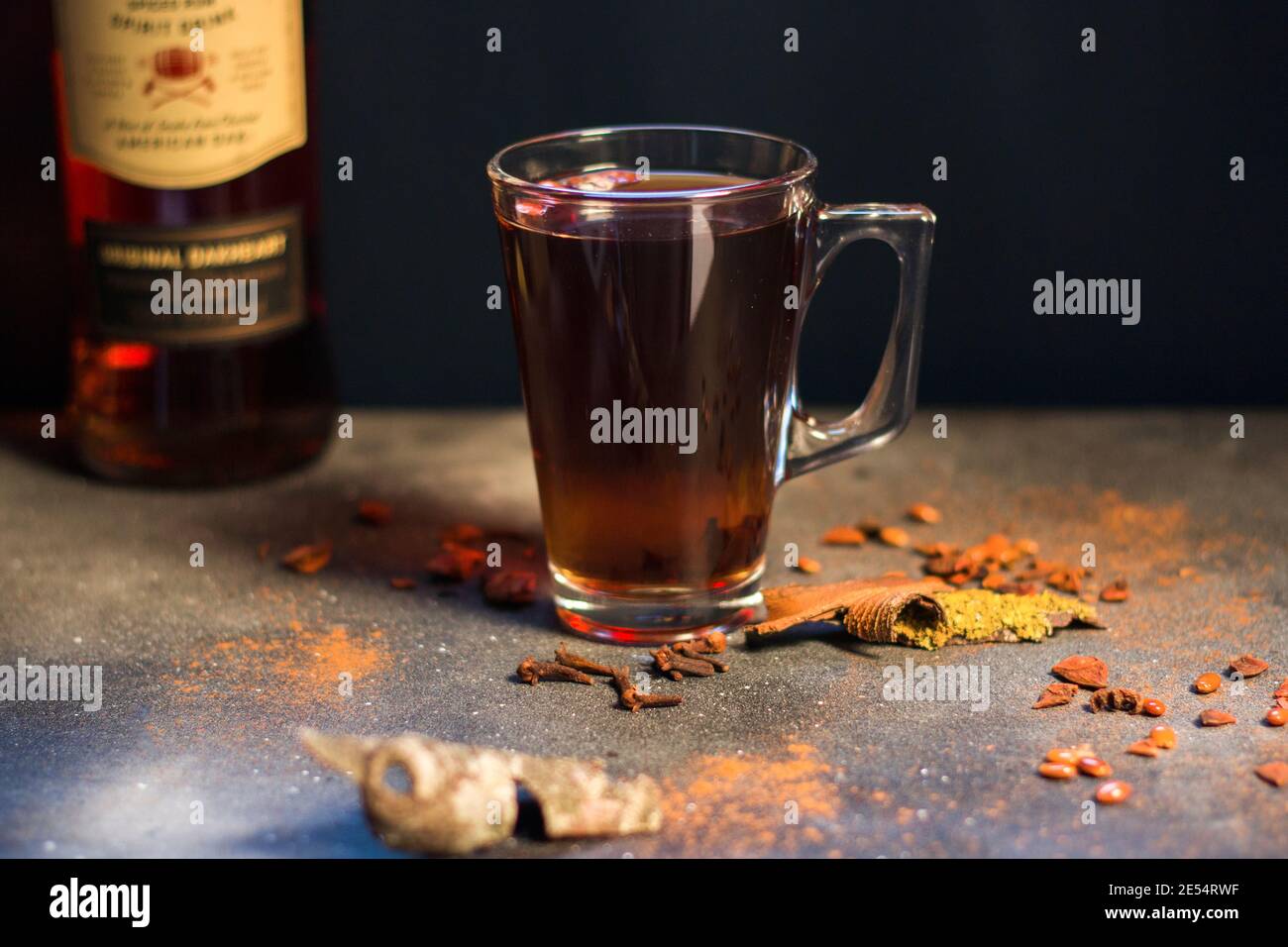 Rome with tea, Grog on the black background Stock Photo - Alamy