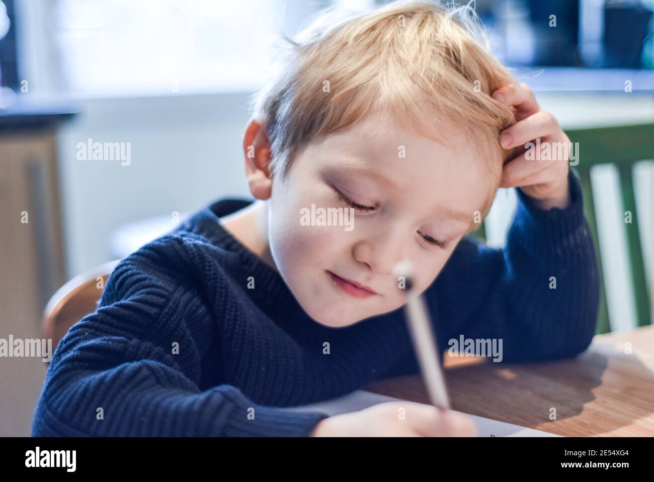 Child doing homework hi-res stock photography and images - Alamy