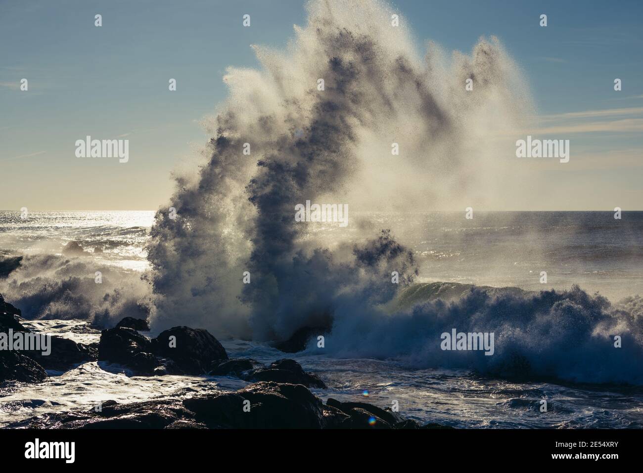 Spectacular wave crashing into rocks of Atlantic Ocean shore in ...