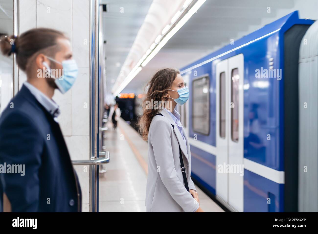 metro passengers standing at a safe distance on the platform Stock ...
