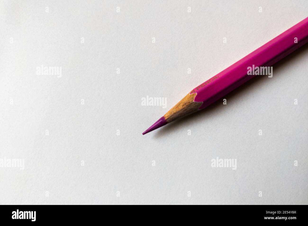 Top view closeup of a colorful sharp pencil isolated on a white ...