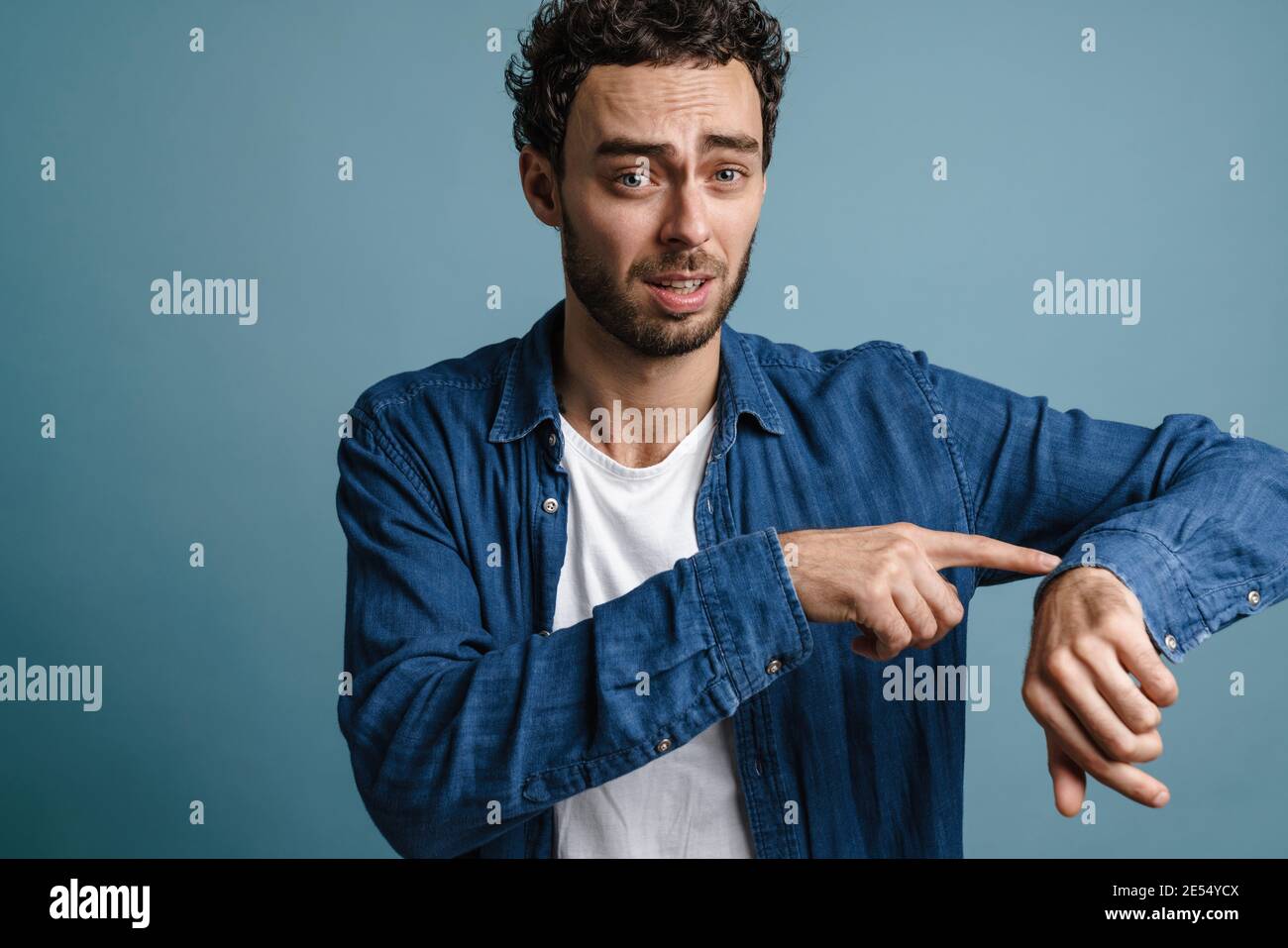 Handsome guy pointing finger hi-res stock photography and images - Alamy