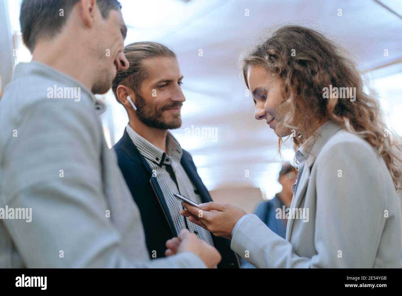 business colleagues discussing something in the subway Stock Photo - Alamy