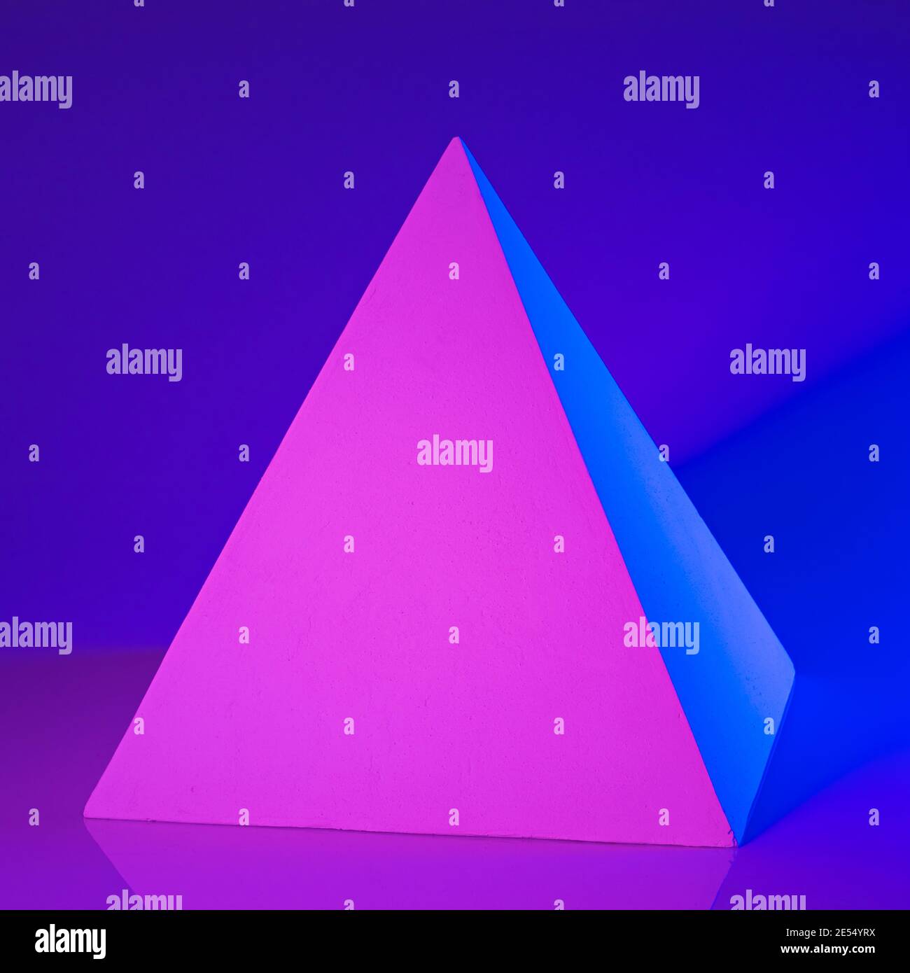 Gypsum pyramid in pink and blue neon light Stock Photo - Alamy