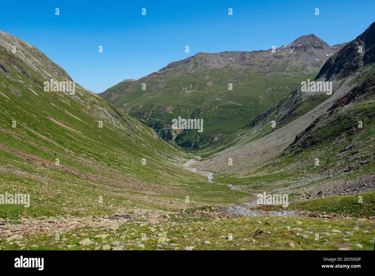 View into a typical trough valley in the Grisons mountains, Switzerland ...