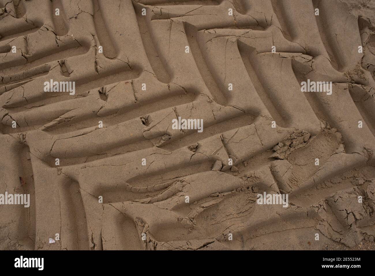 Abstract tracks through sand on a beach Stock Photo - Alamy