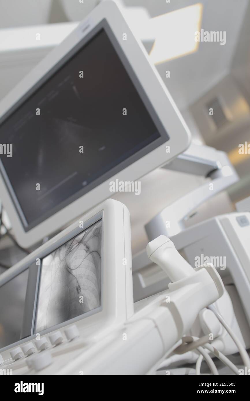 Echo machine with a sensor and projected ultrasound images of heart and ...