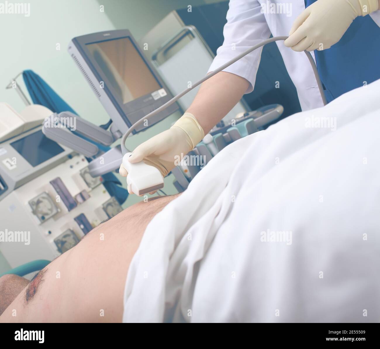 Doctor ultrasonographer examines patient in the hospital Stock Photo ...